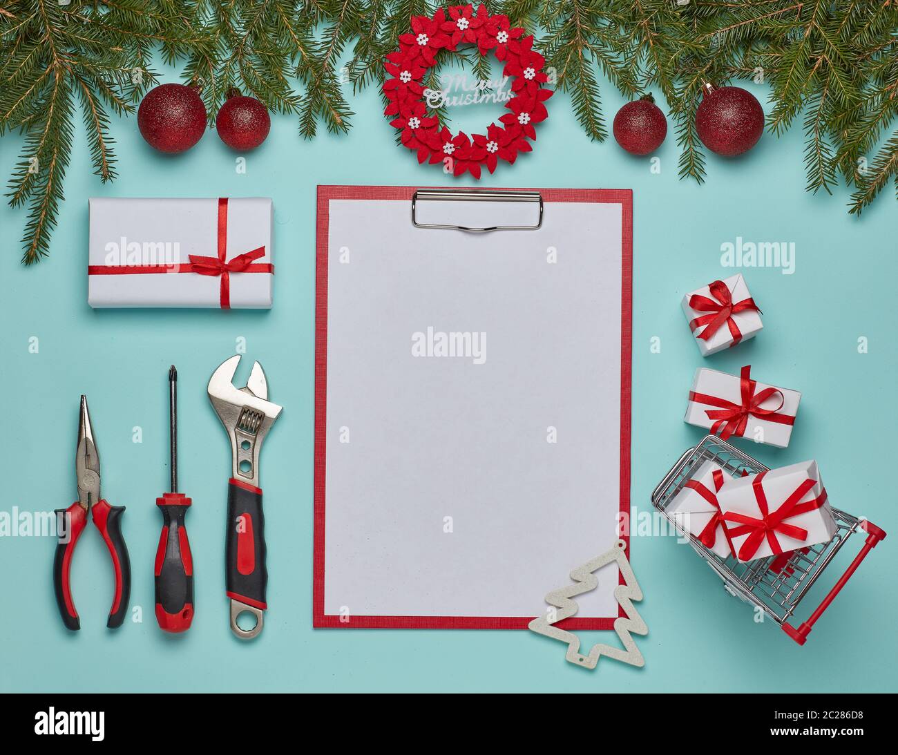 Construction tools, shopping trolley, gift boxes, blank clipboard, fir ...