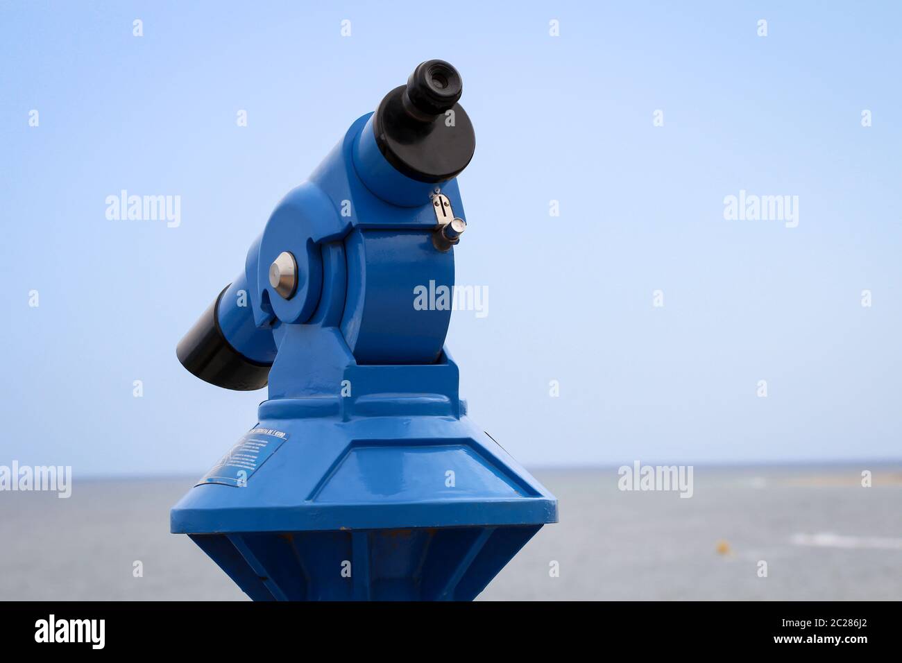 Telescope with a view of the beach Stock Photo - Alamy