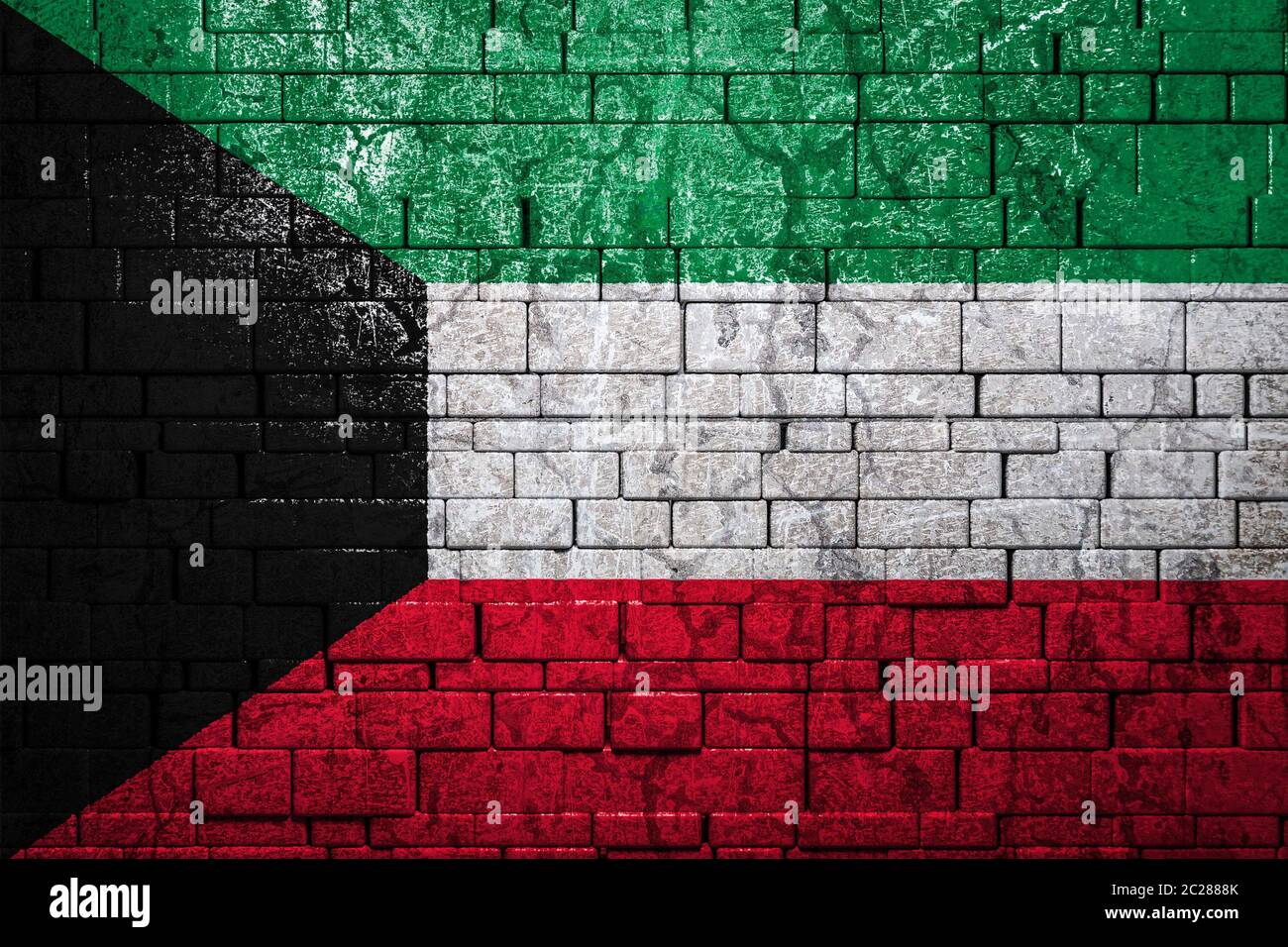 National flag of Kuwait on brick wall background.The concept of ...