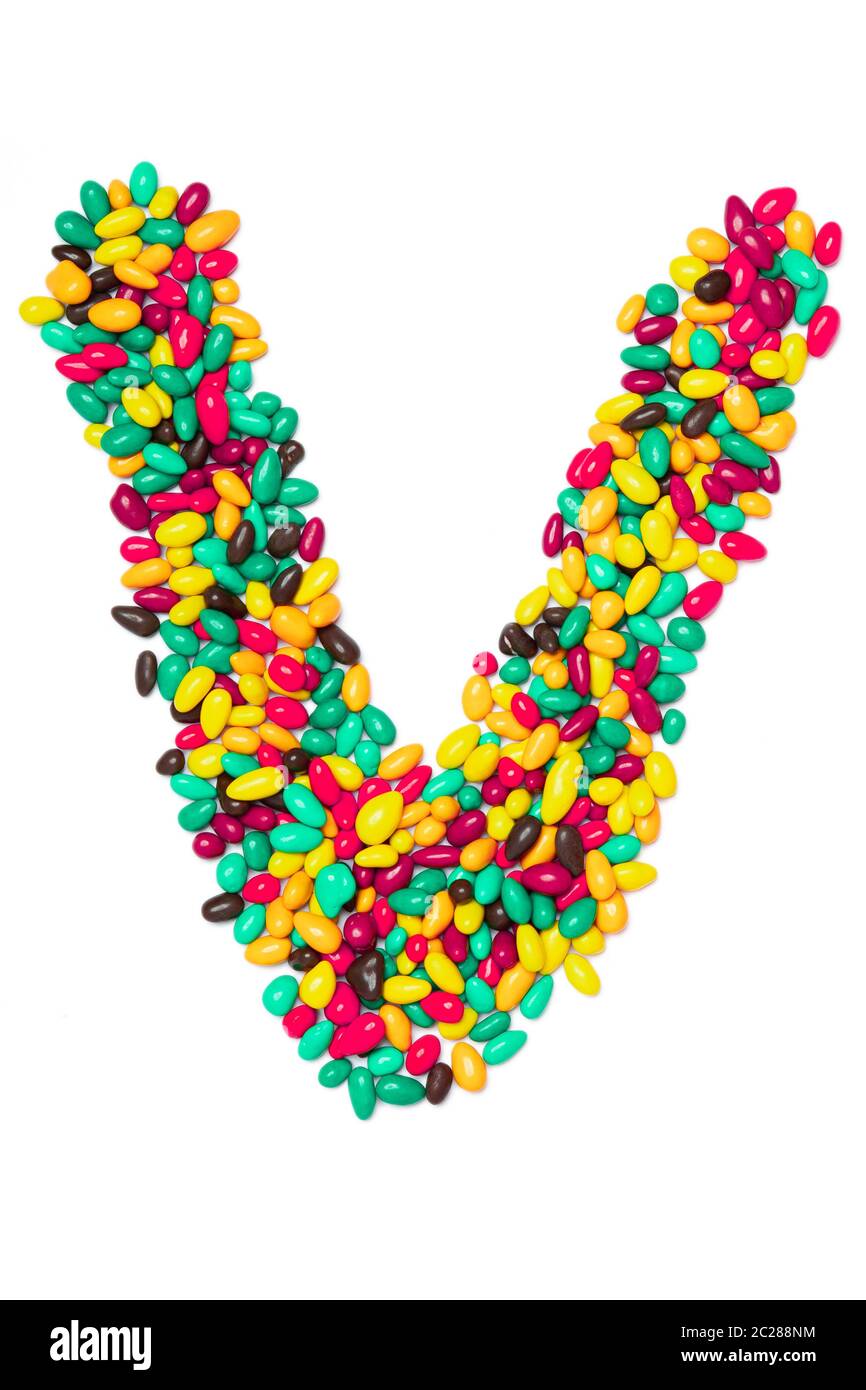 Letter V of the English alphabet from multicolored round chocolates on ...