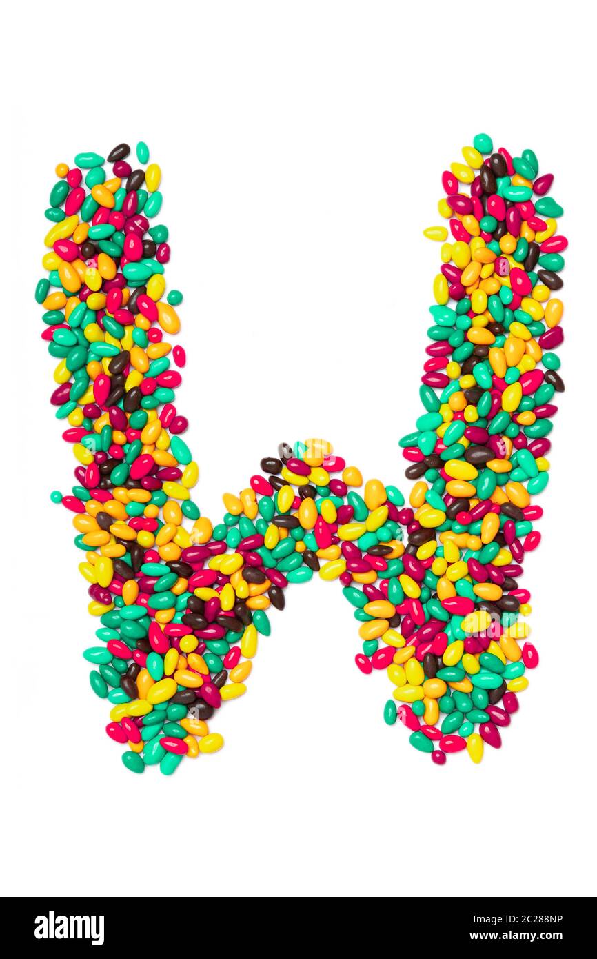 Letter W of the English alphabet from multicolored round chocolates on ...