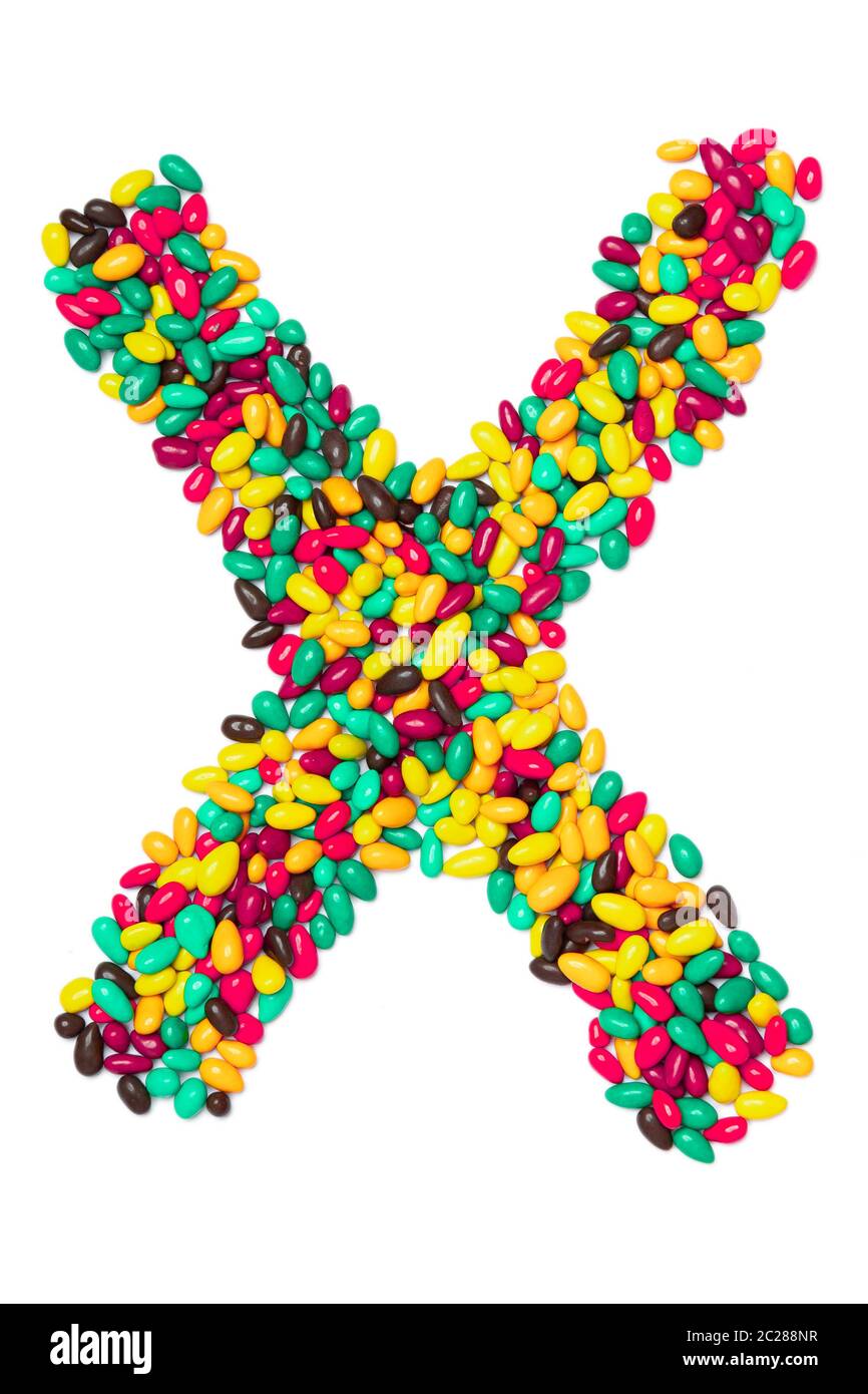 Letter X of the English alphabet from multicolored round chocolates on ...