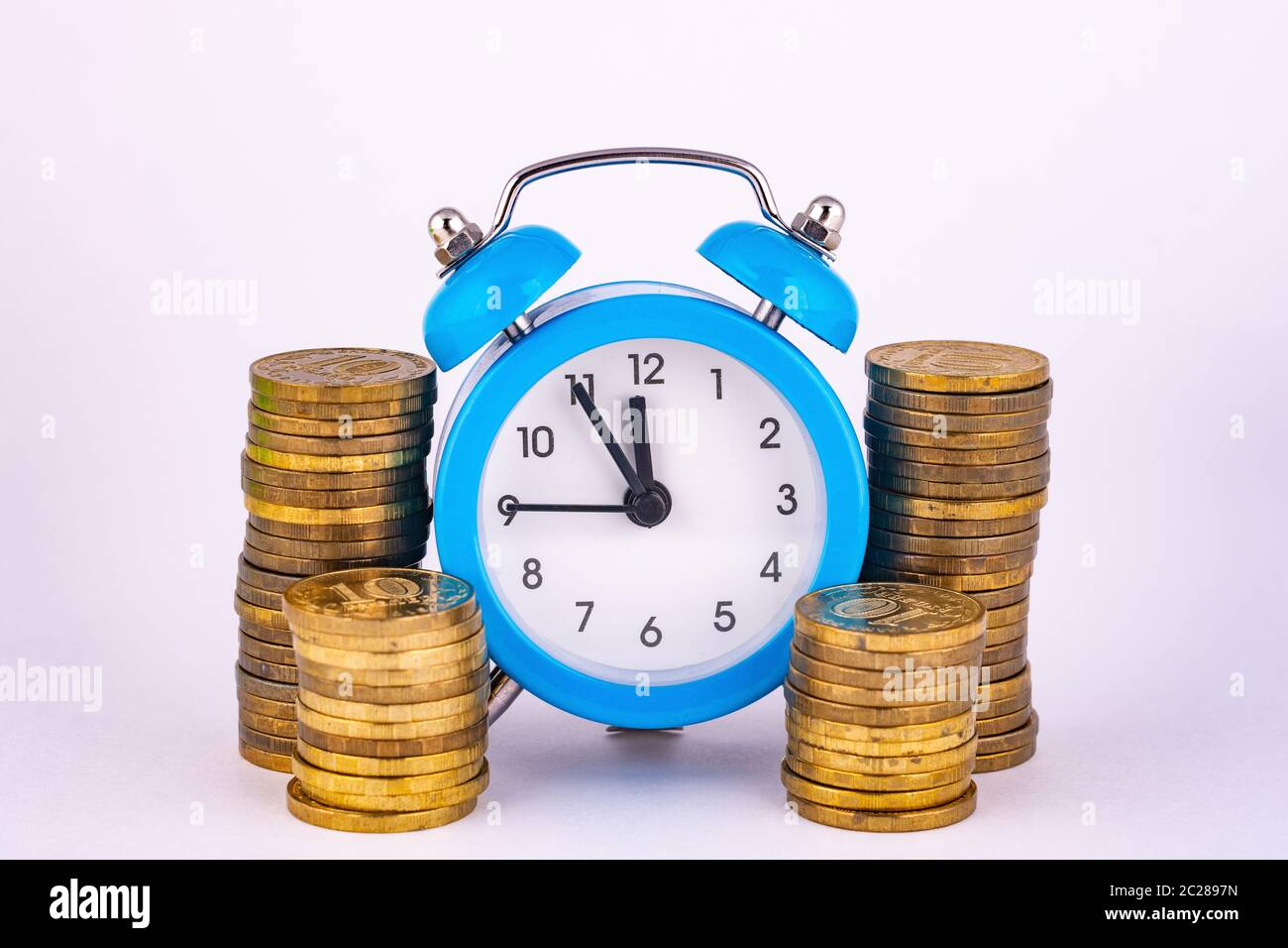 Clock coins piles hi-res stock photography and images - Alamy