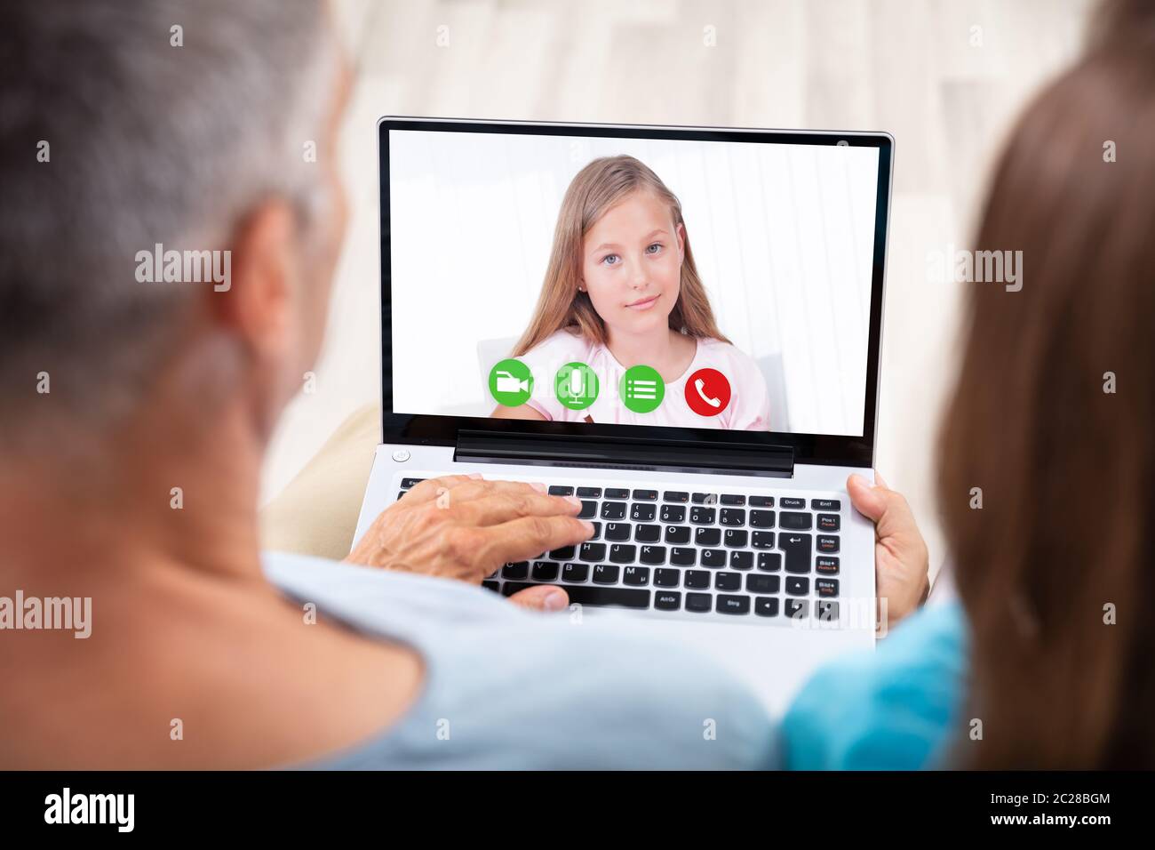 Couple Video Conferencing With Their Daughter On Laptop Stock Photo - Alamy