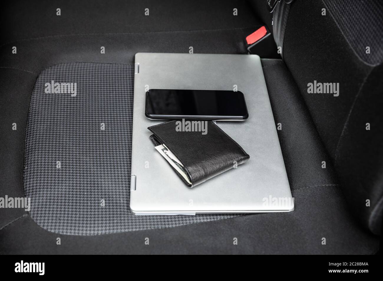 Mobile Phone And Laptop On Car's Seat Stock Photo - Alamy