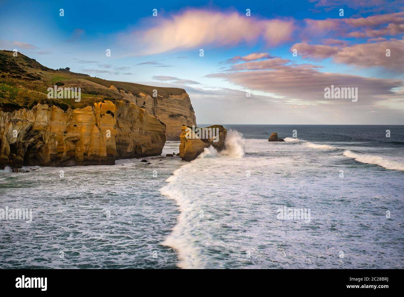 Tunnel beach coastal cliff scenery Stock Photo - Alamy