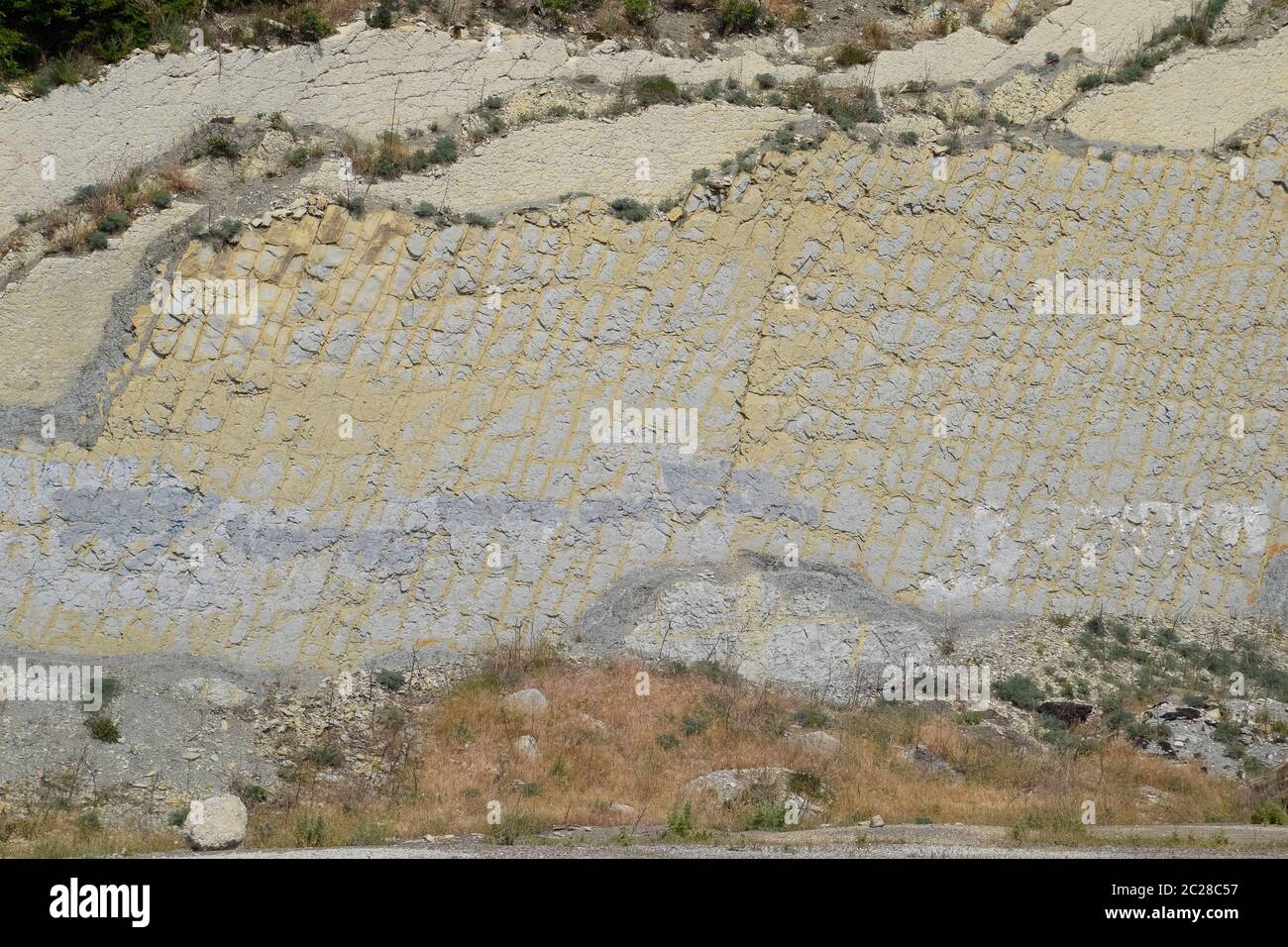 slope of the mountain with layers of sedimentary rocks. Vertically ...