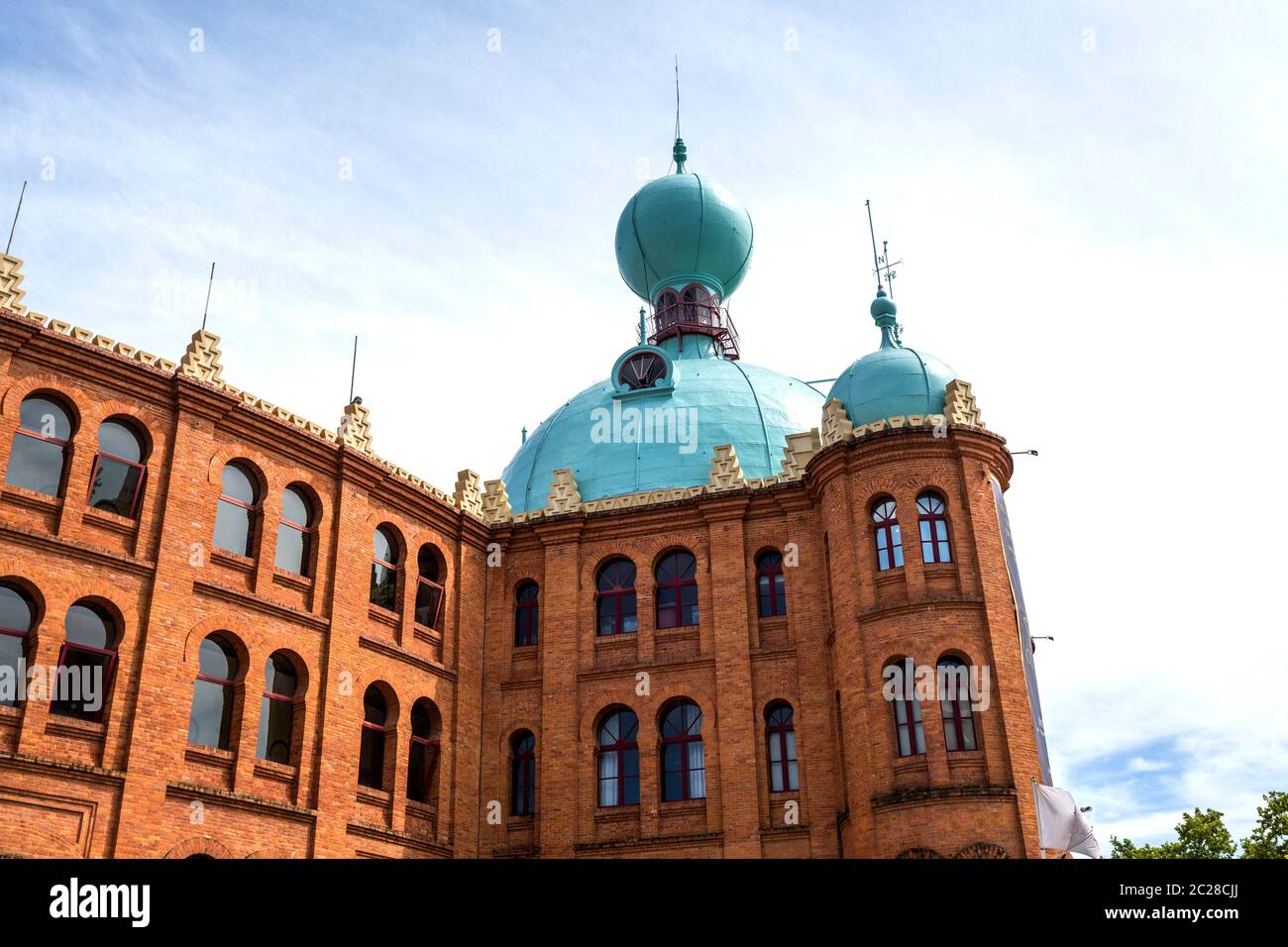 Blue domes and red bricks of the famous bullring of Lisbon, Portugal ...