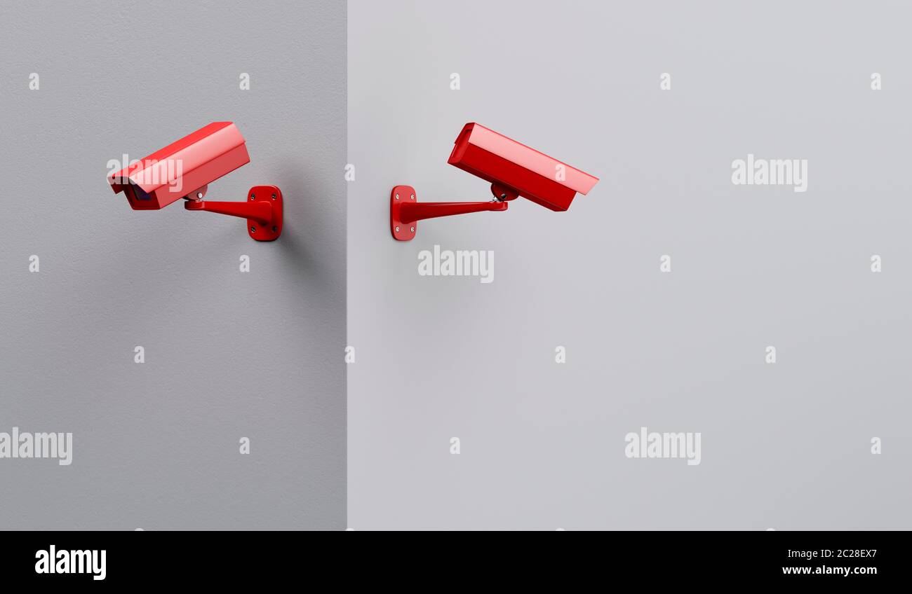 Two red security cameras on the wall Stock Photo - Alamy
