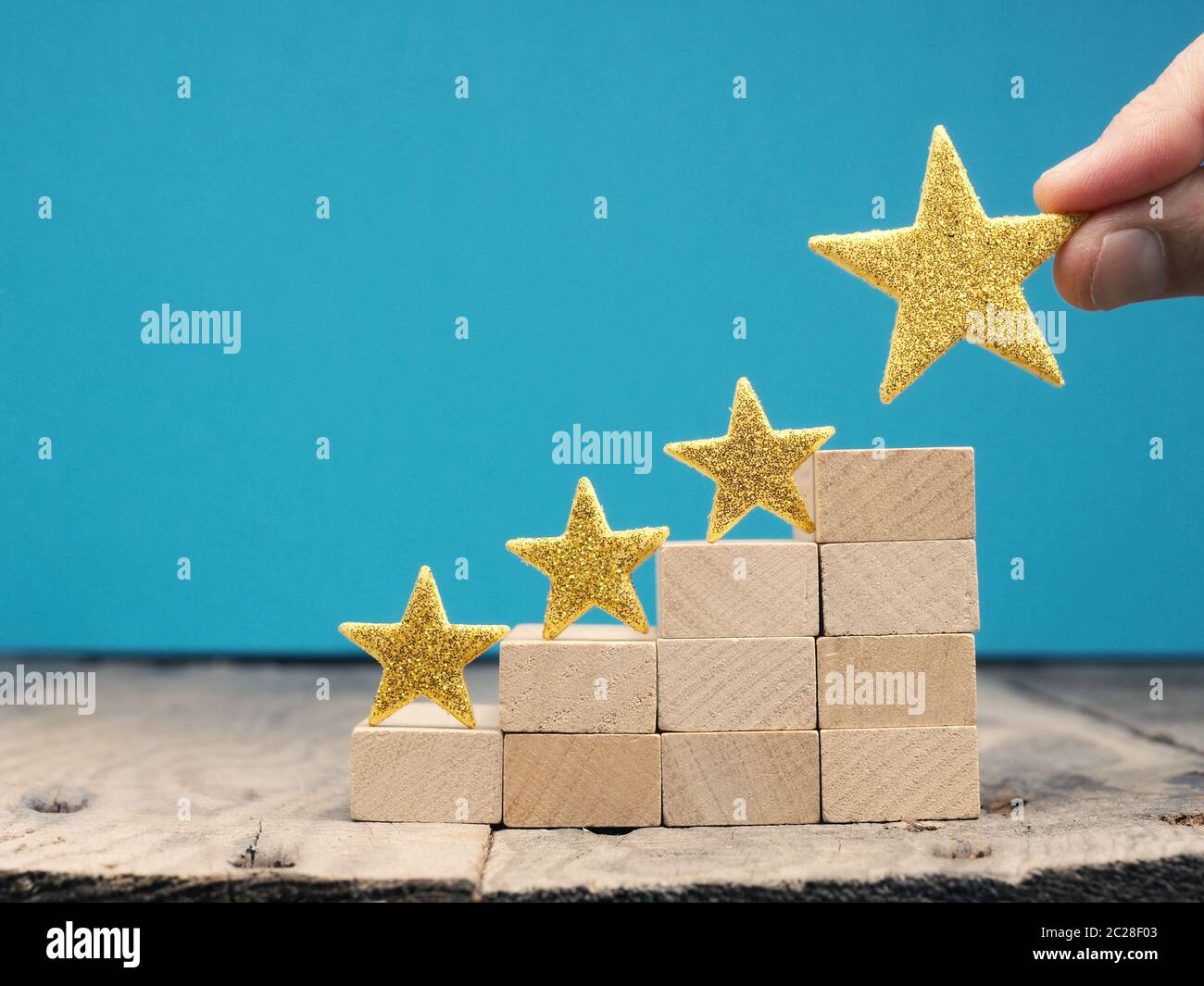 Businessman with a big golden star, rating or ranking system concept ...