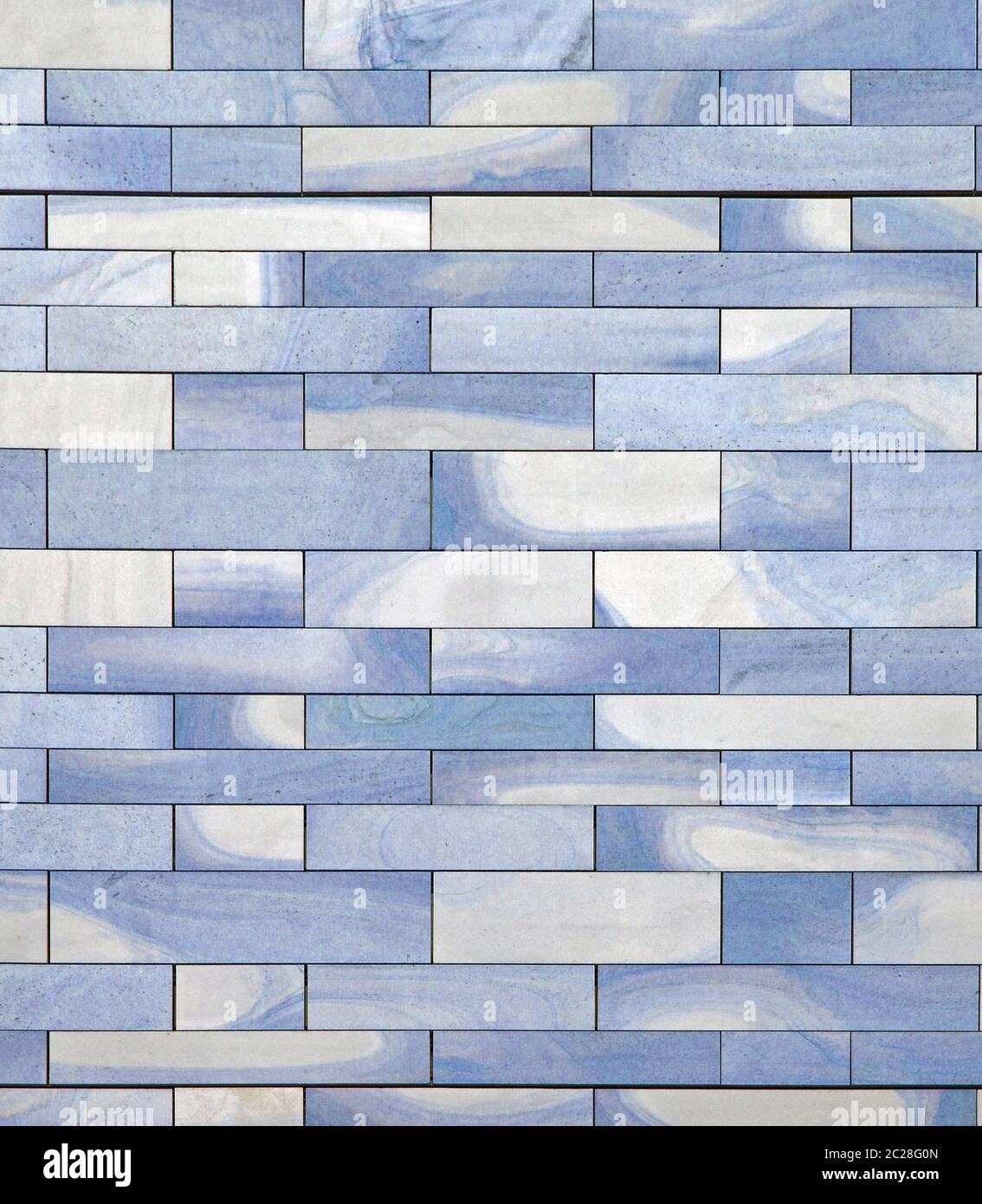 blue toned image of a stone wall with a textured surface and geometric ...