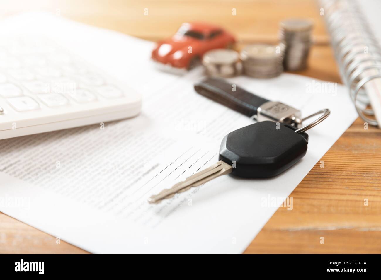 Car purchase concept. Car keys, calculator, toy car, coins and purchase ...