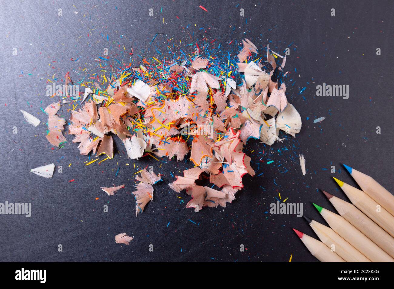 Back to school, education concept. Color pencil sharpening shavings and ...