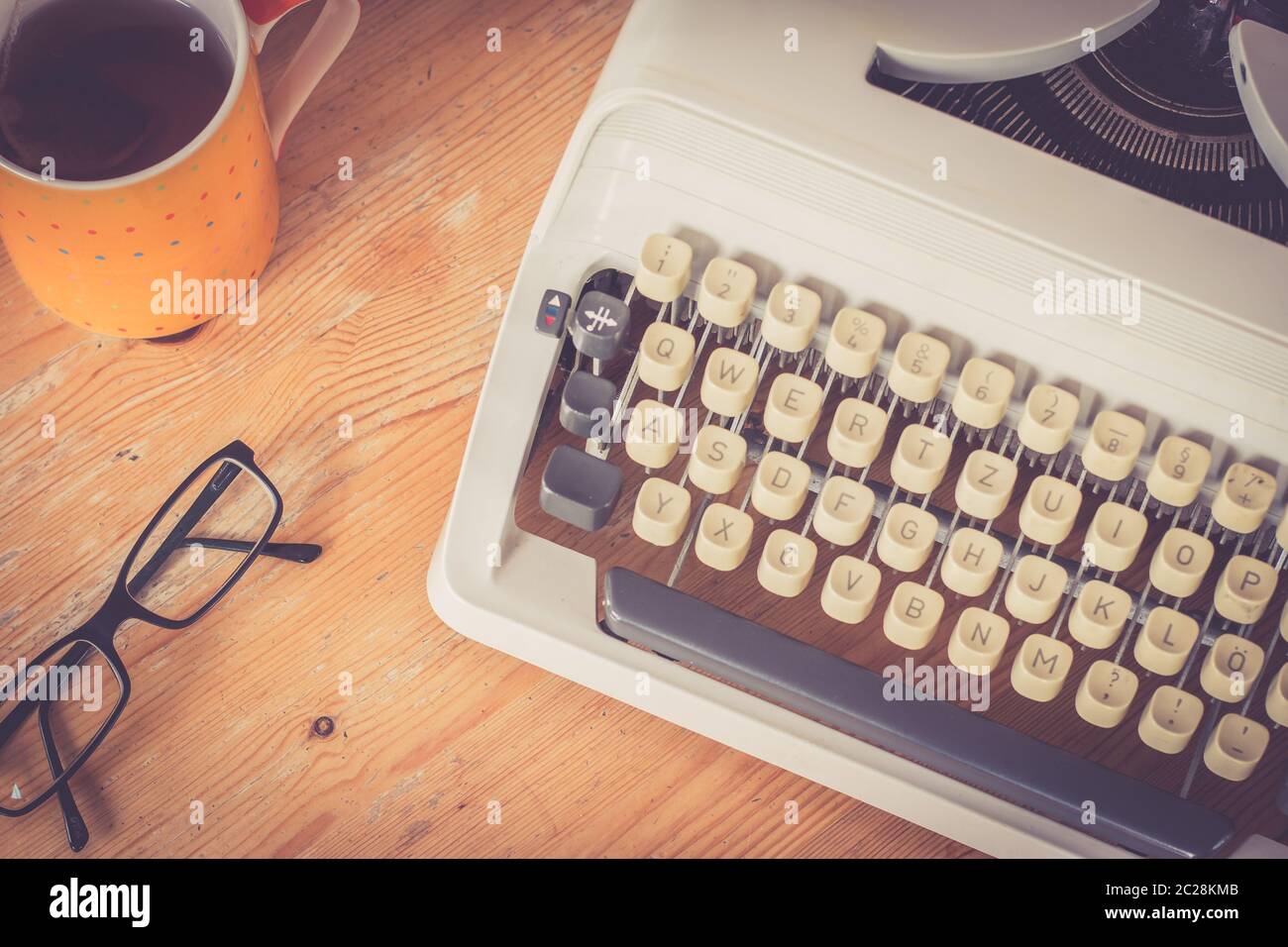Old fashioned vintage typewriter on wood desk Stock Photo - Alamy