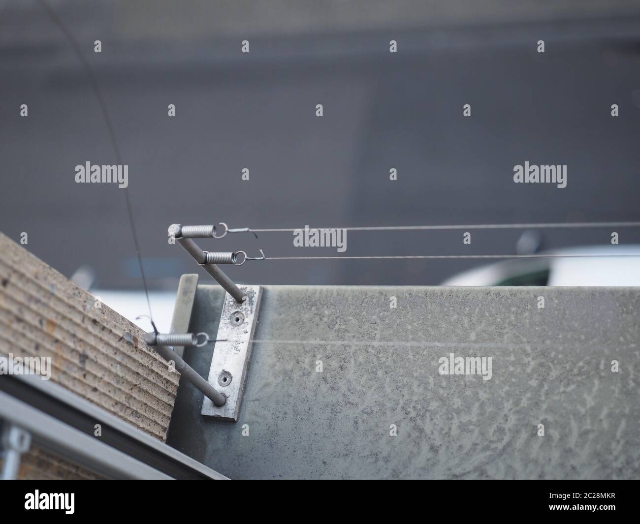 bird wire deterrent on a window sill Stock Photo - Alamy