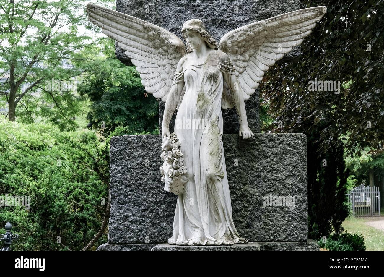 Berlin, Germany. 12th June, 2020. A marble angel stands in the cemetery ...
