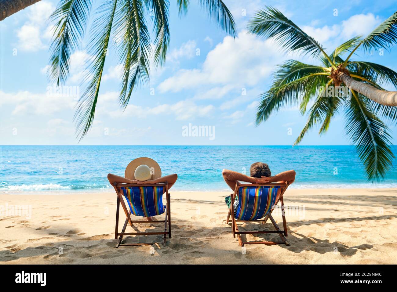 Couple relax on the beach enjoy beautiful sea on the tropical island ...