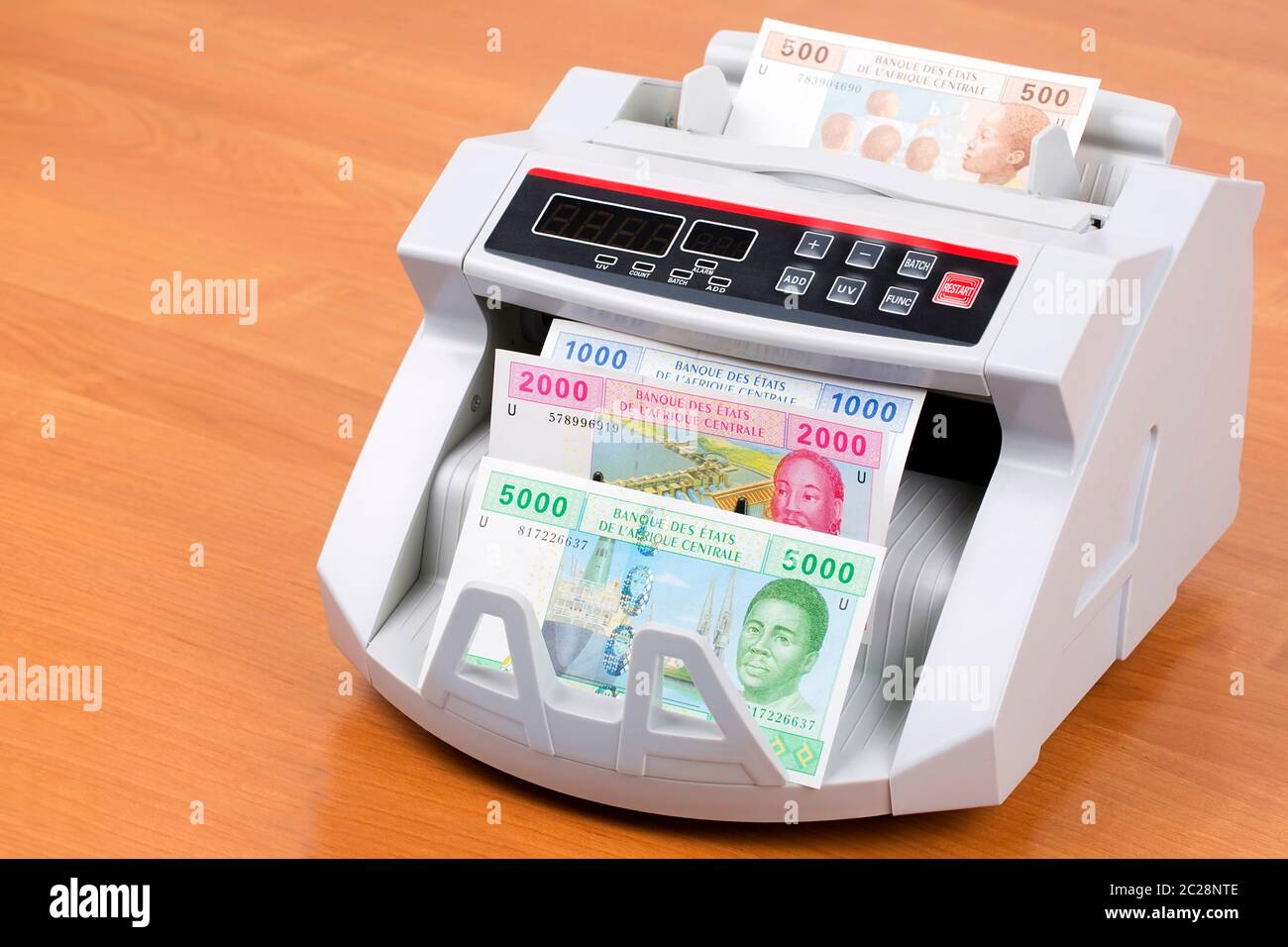 Central African money in a counting machine Stock Photo - Alamy