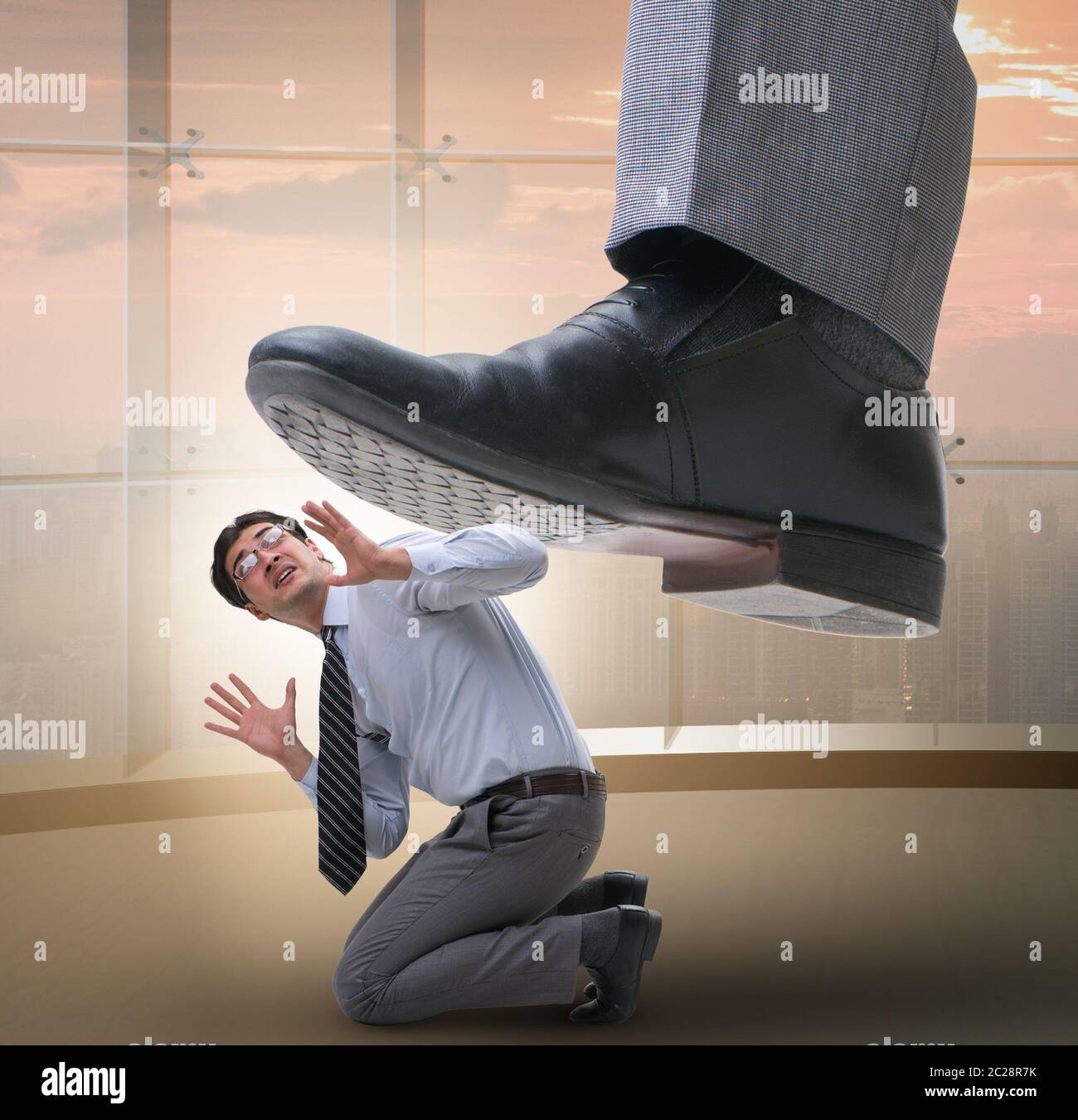 Bad angry boss stamping on employee in business concept Stock Photo - Alamy