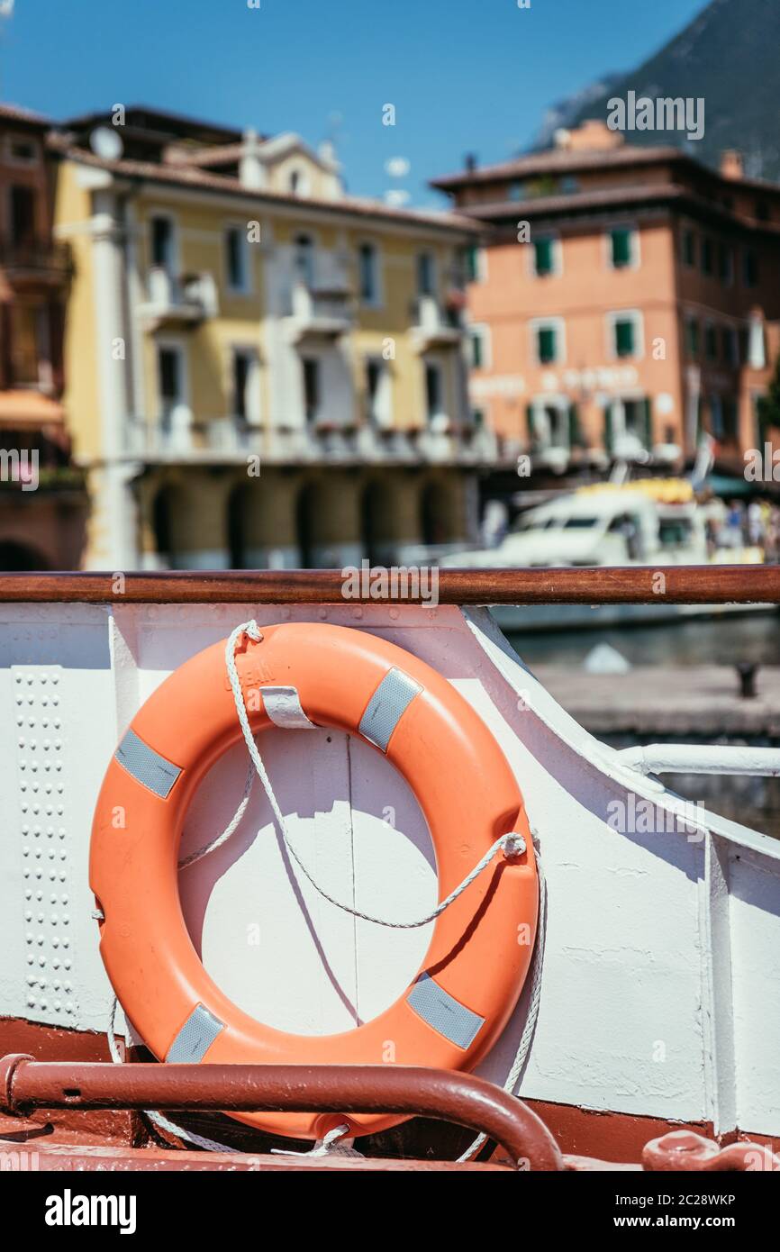 Boat tour: Boat bow, view over azure blue water, village and mountain ...