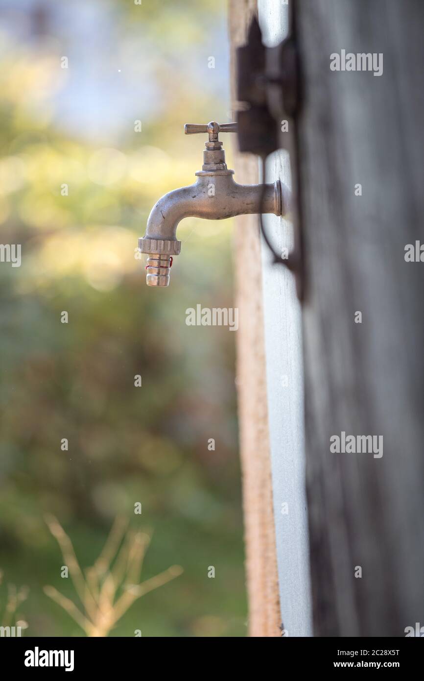 Spigot on a farm, outside, copy space Stock Photo - Alamy