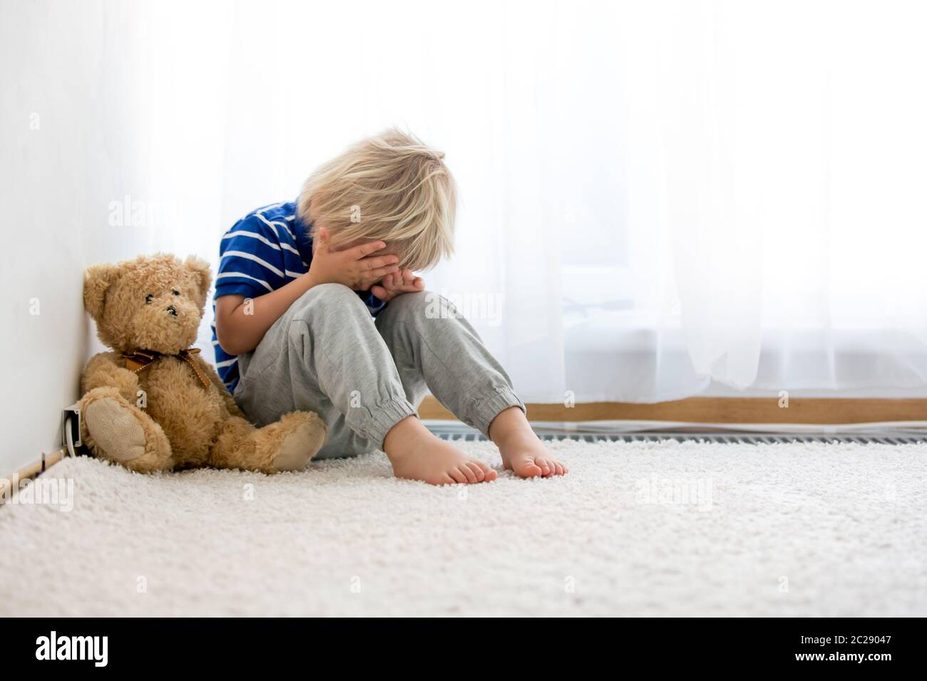 Child, toddler boy, punished in the corner for making mischieves Stock ...