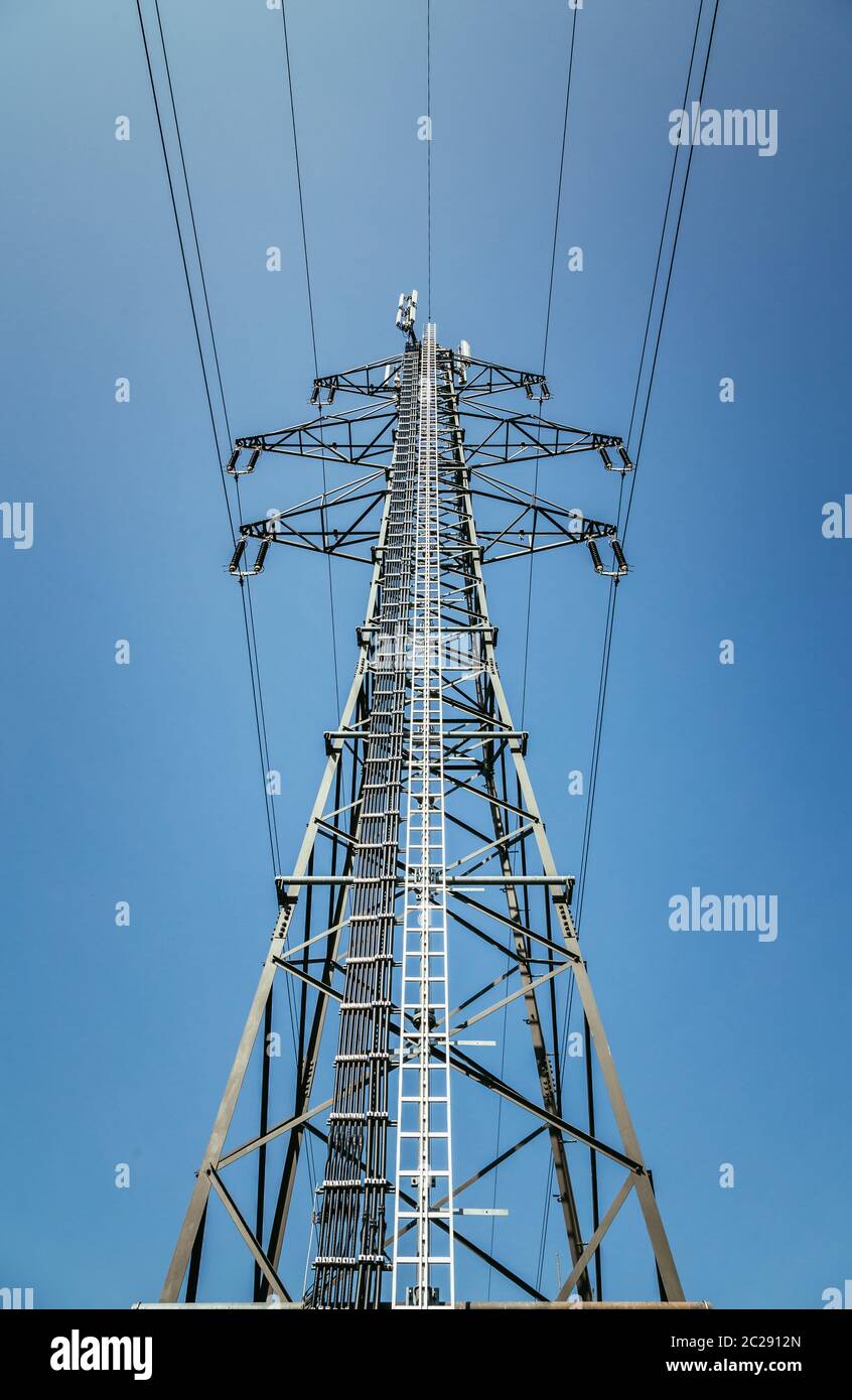 Close up of electrical tower and blue sky. Renewable energy and smart ...