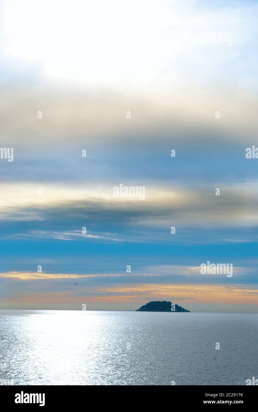 Small island in the sea. Sunset above the ocean Stock Photo - Alamy