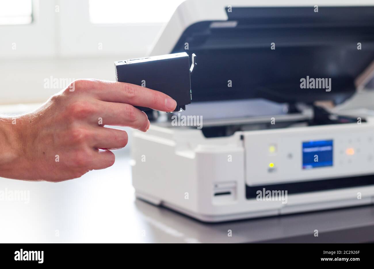 Refilling third party printer cartridges, inkjet Stock Photo - Alamy