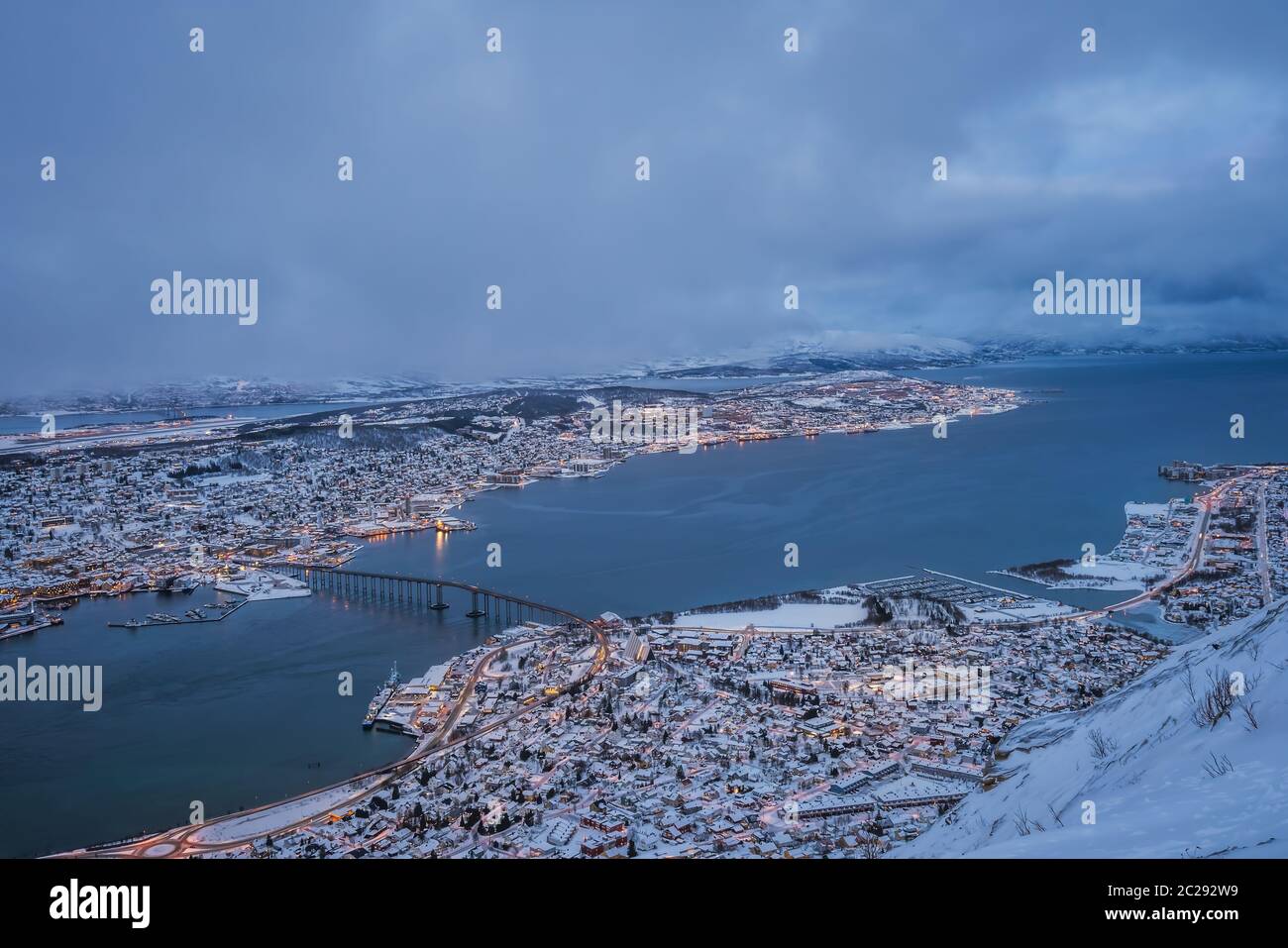 Aerial view to the city of Tromso in winter from the mountain ledge ...