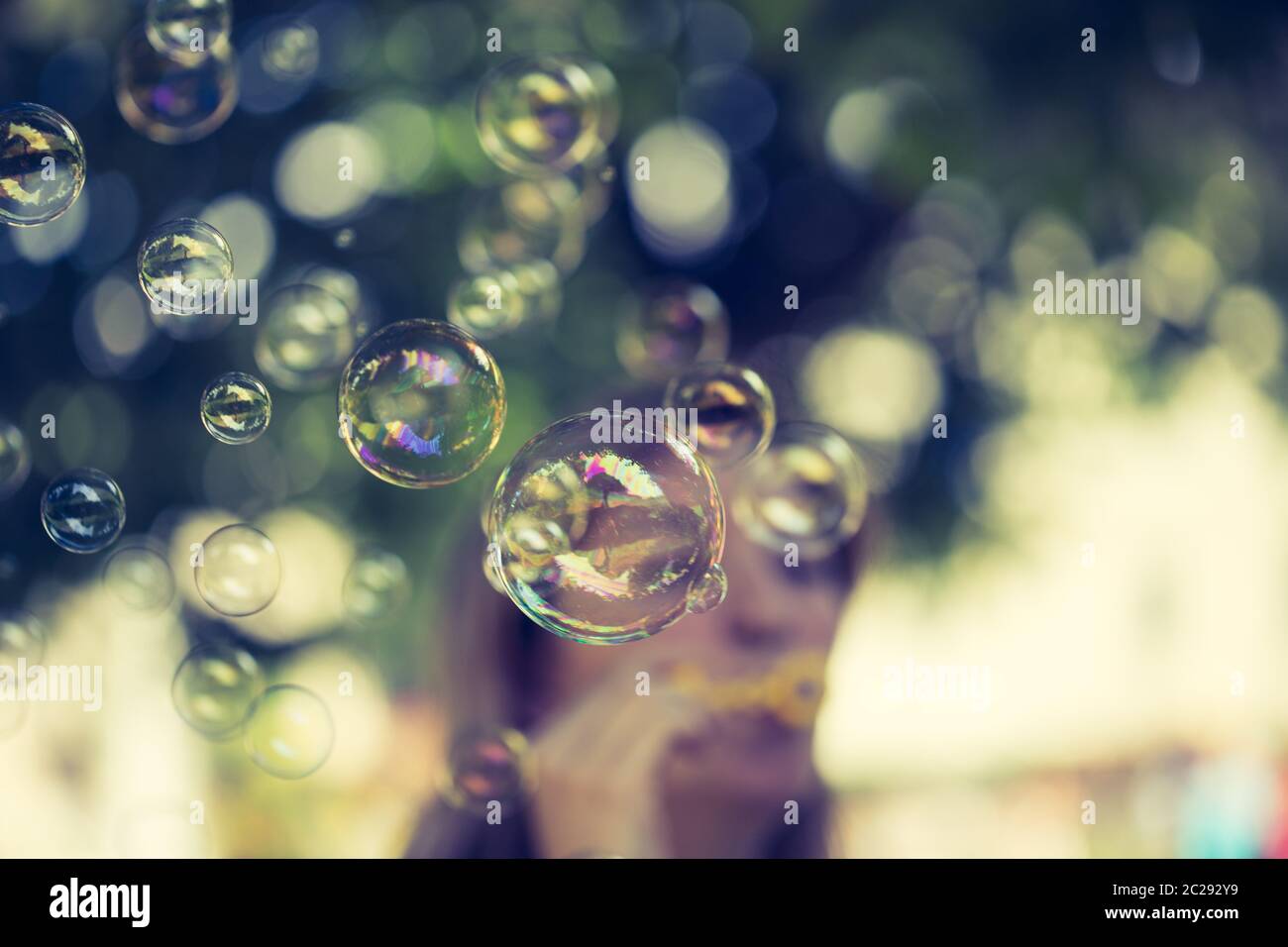 Soap bubbles floating in the air, summer time Stock Photo - Alamy