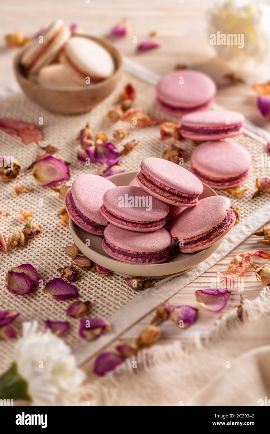 French macarons with raspberry and rose buttercream. Pink French macarons Stock Photo - Alamy