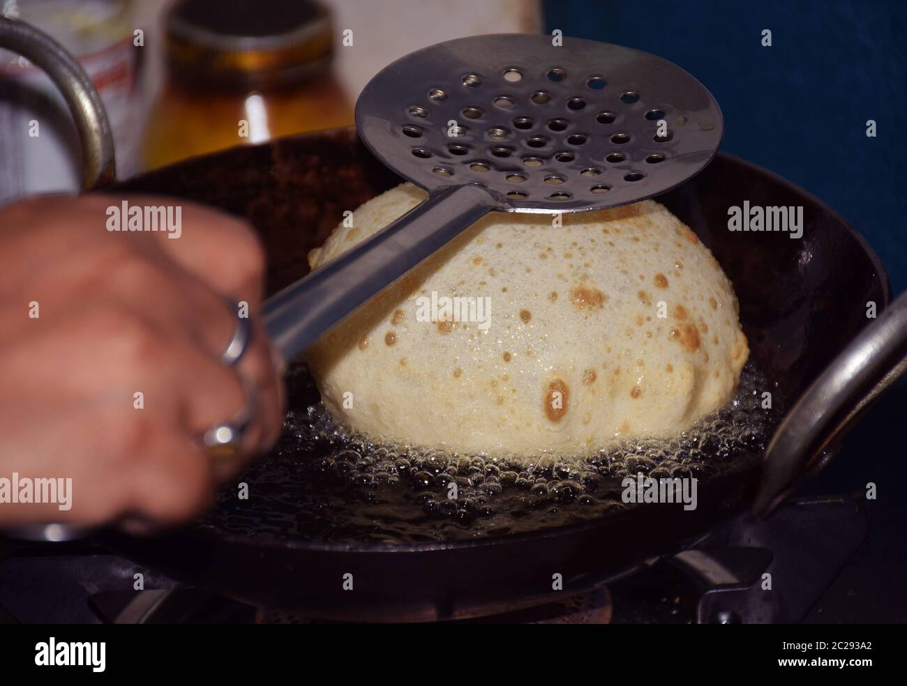 Delicious Bhatoora or Bhature (Fried Bread) preparation in progress ...
