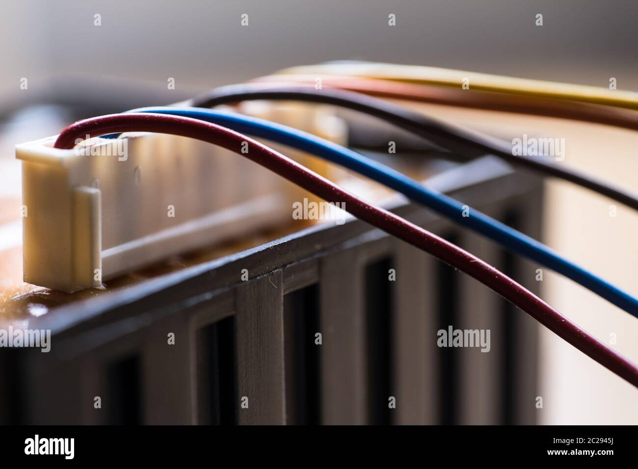 Colored power cables that come from a transformer Stock Photo - Alamy