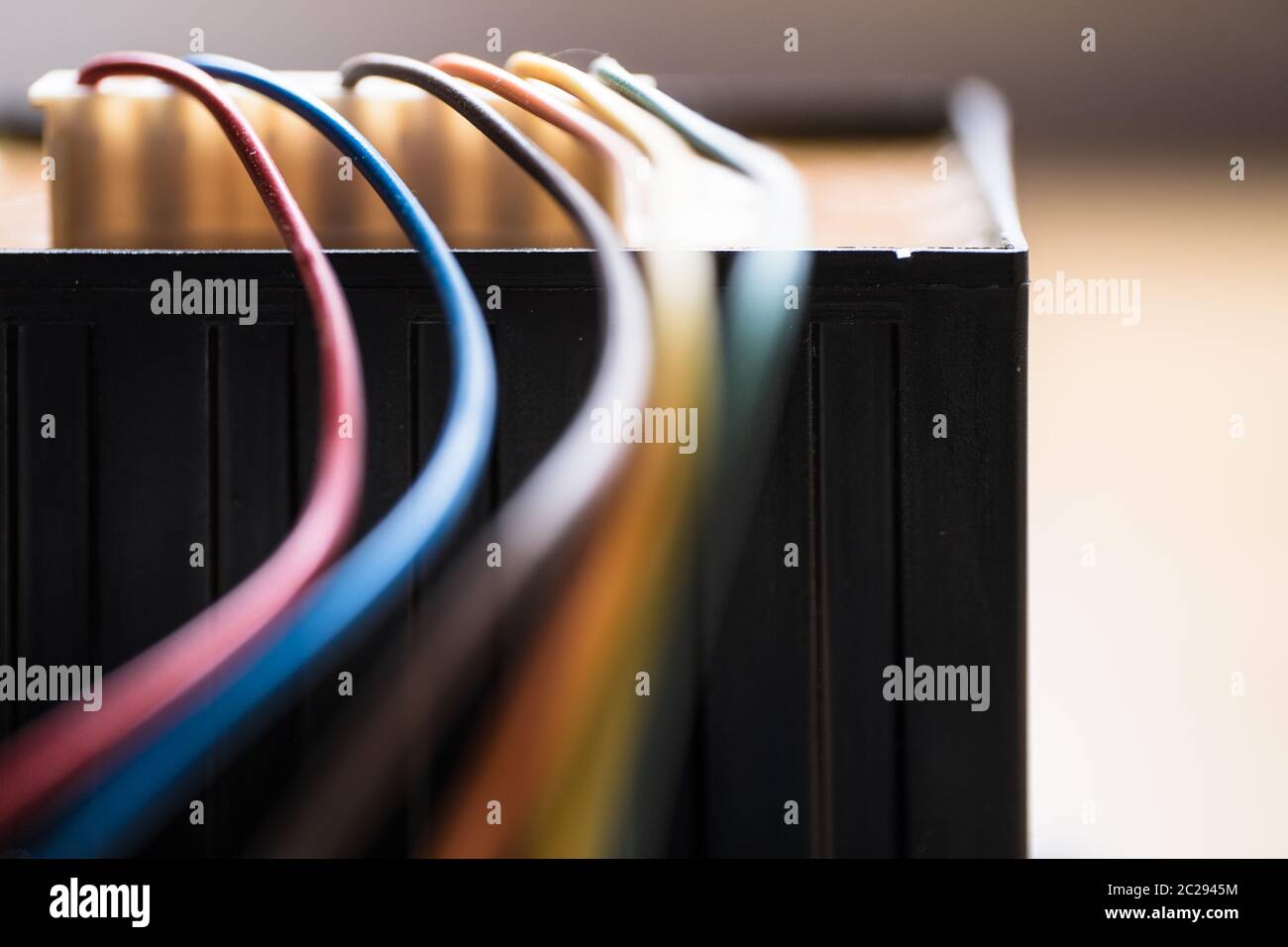 Colored power cables that come from a transformer Stock Photo - Alamy