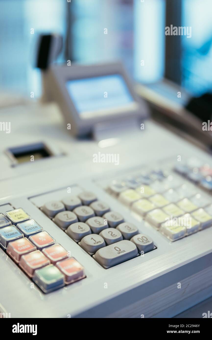 Cash register in a store, sales; Blurry Background Stock Photo - Alamy