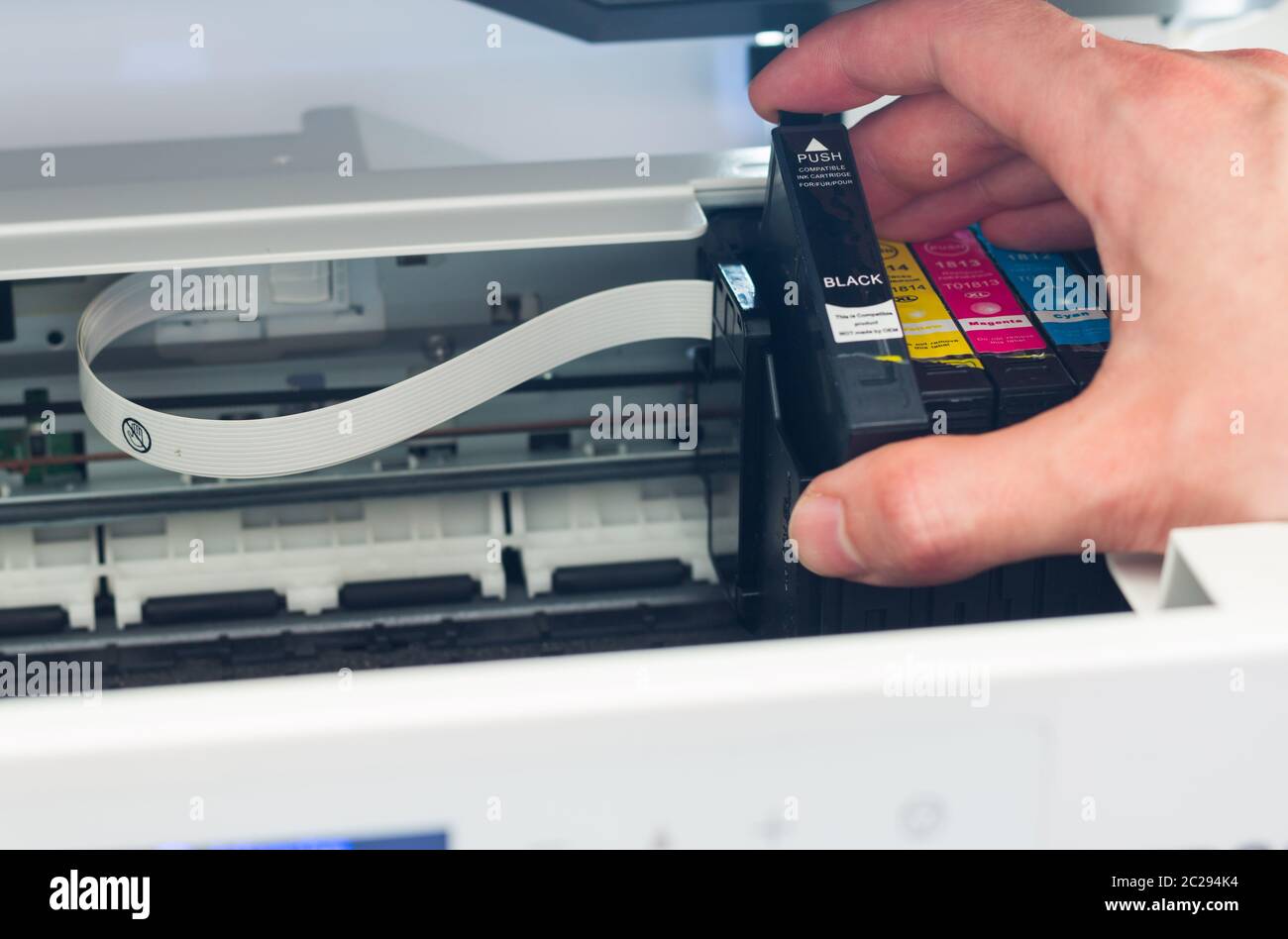 Refilling third party printer cartridges; inkjet Stock Photo - Alamy