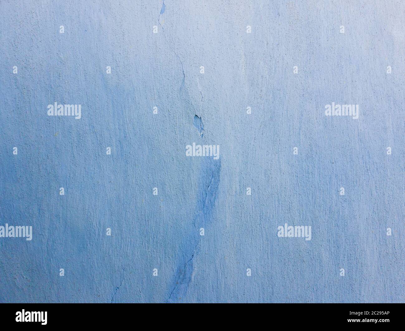 Blue lime coating texture on the old wall texture with a crack in the ...