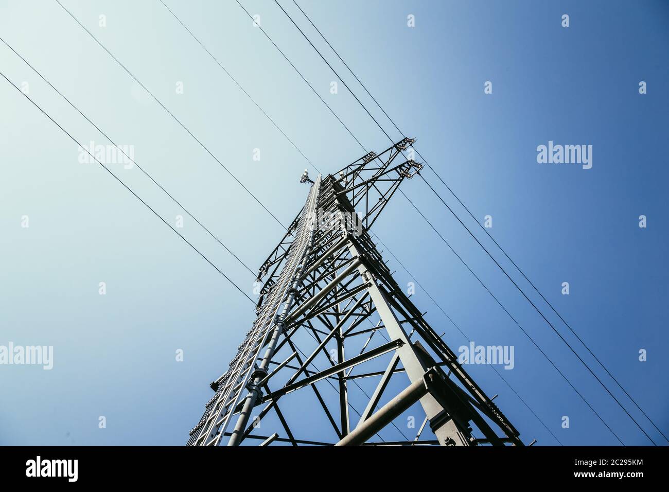 Close up of electrical tower and blue sky. Renewable energy and smart ...