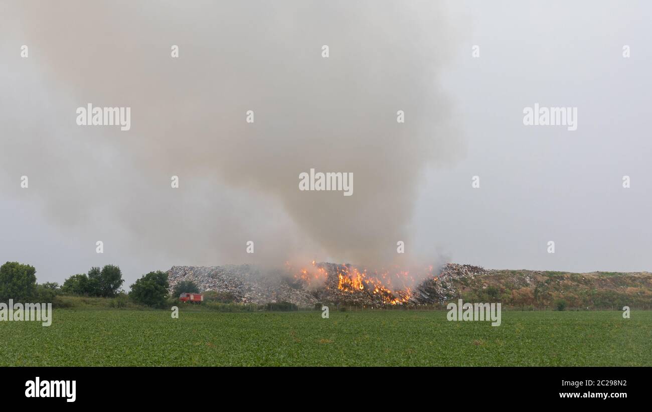 Landfill Garbage Fire Inferno With Heavy Smoke Stock Photo - Alamy
