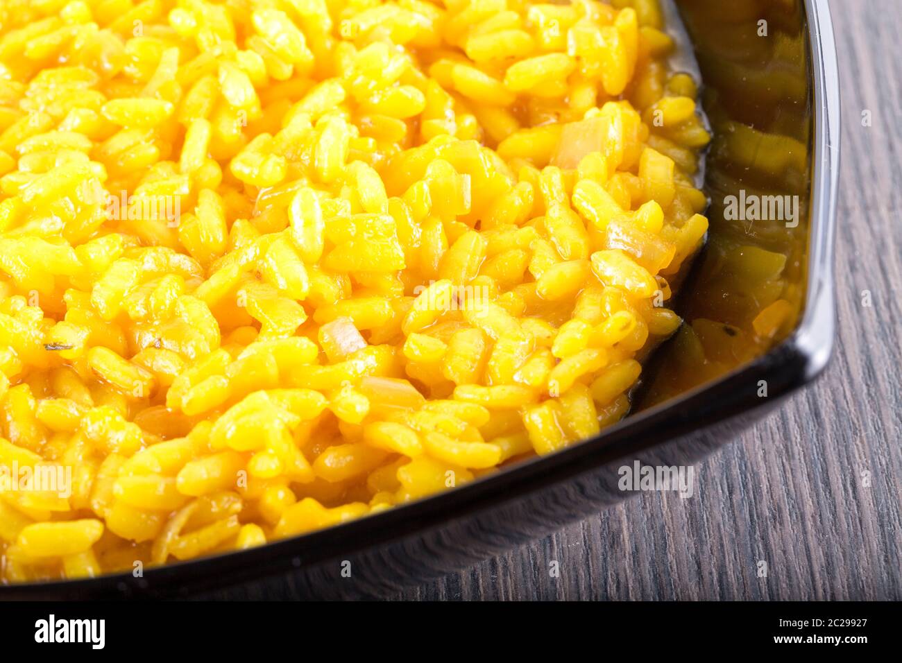 Yellow rice in close up, horizontal image Stock Photo - Alamy