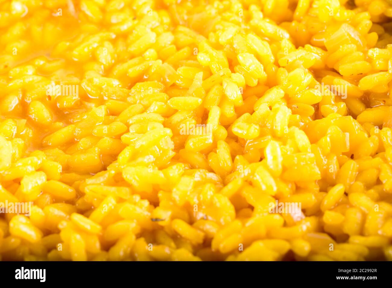 Yellow rice in close up, horizontal image Stock Photo - Alamy