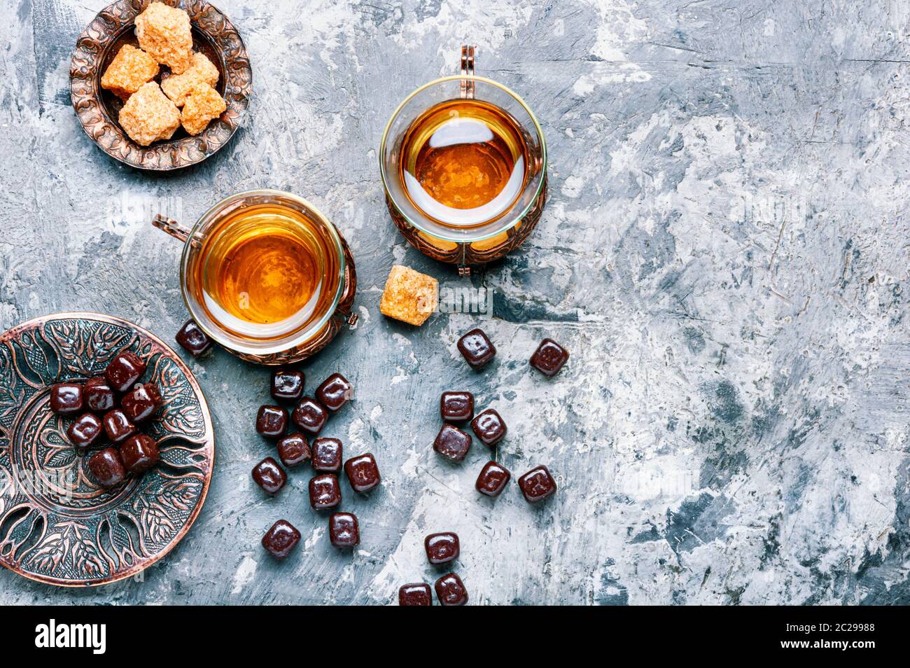 Eastern tea concept.Eastern tea in traditional glass with chocolate ...