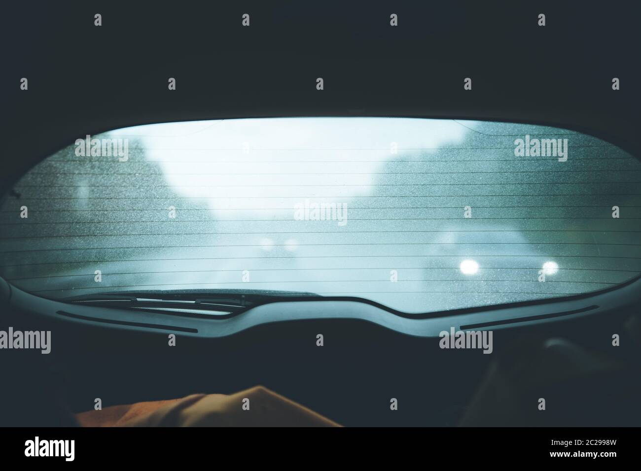 View through the back window of a car, rainy day Stock Photo - Alamy