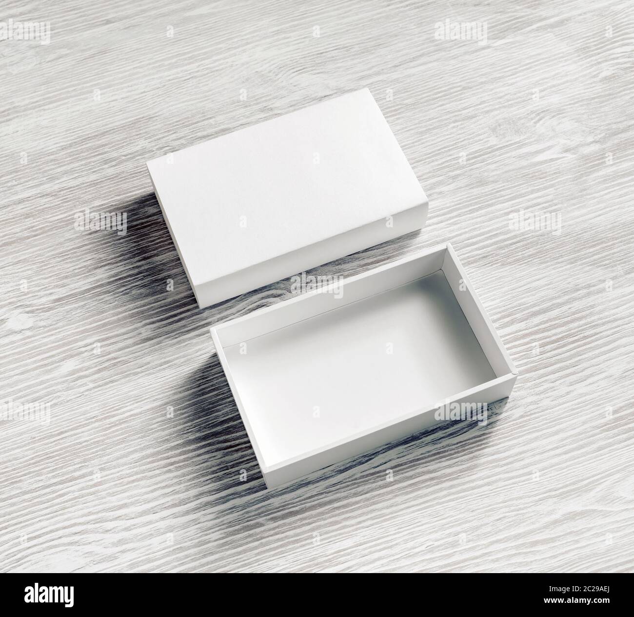 Blank paper box on light wooden background. White box mockup. Branding ...