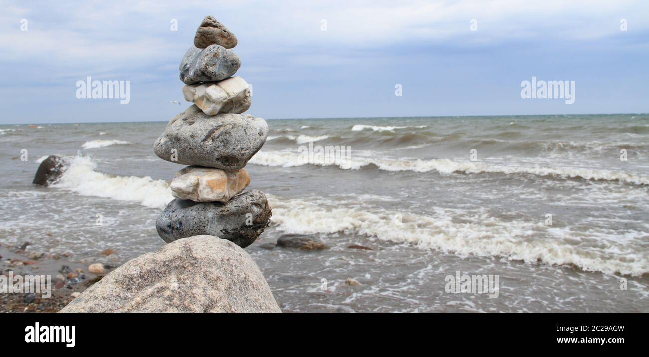 Stone pyramid on the beach Stock Photo - Alamy