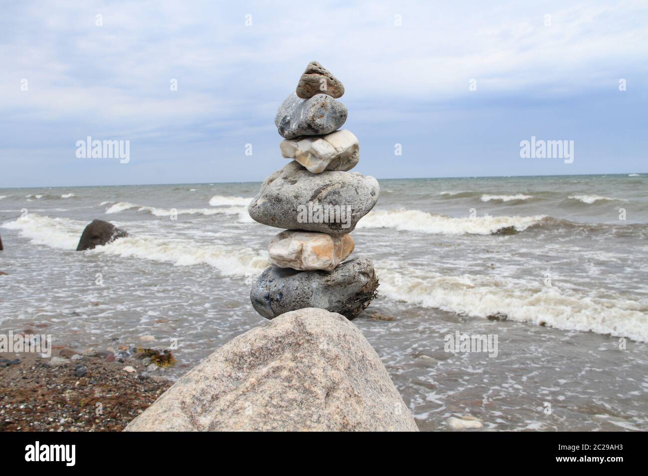 Stone pyramid on the beach Stock Photo - Alamy