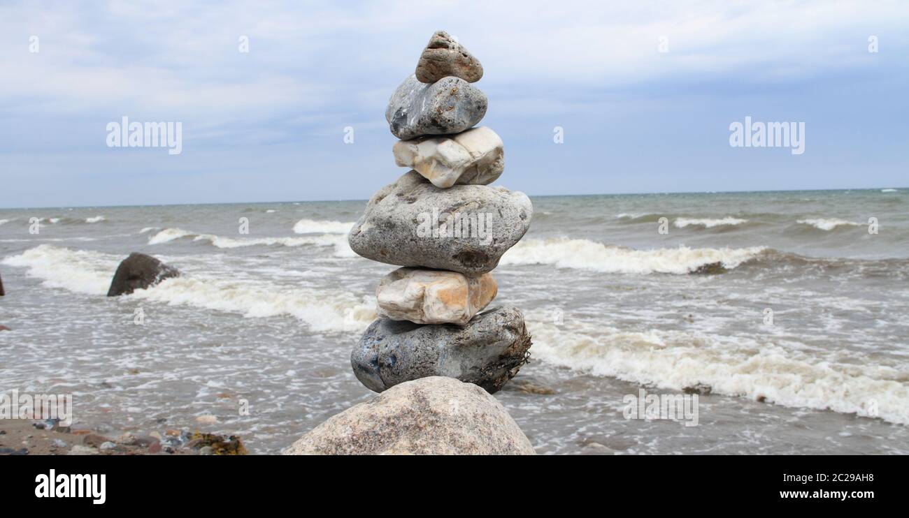 Stone pyramid on the beach Stock Photo - Alamy