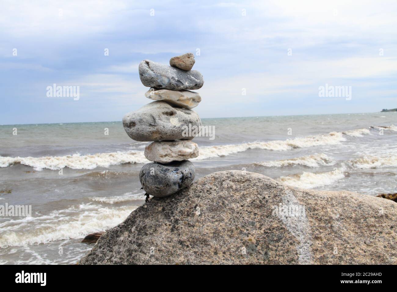 Stone pyramid on the beach Stock Photo - Alamy