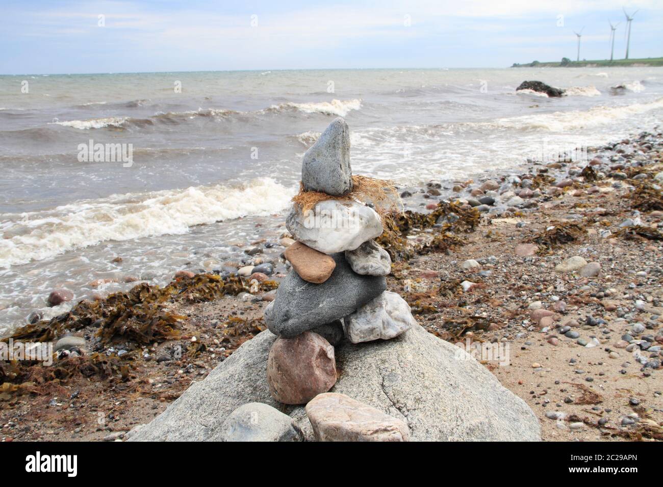 Stone pyramid on the beach Stock Photo - Alamy